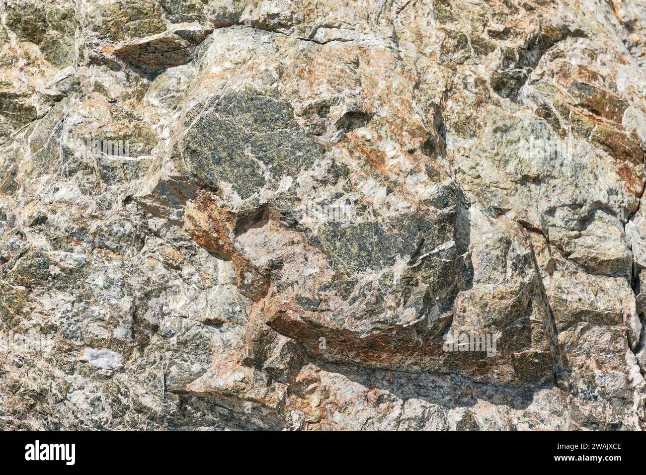 Texture of raw block of natural stone of greenish tint, similar to the ...