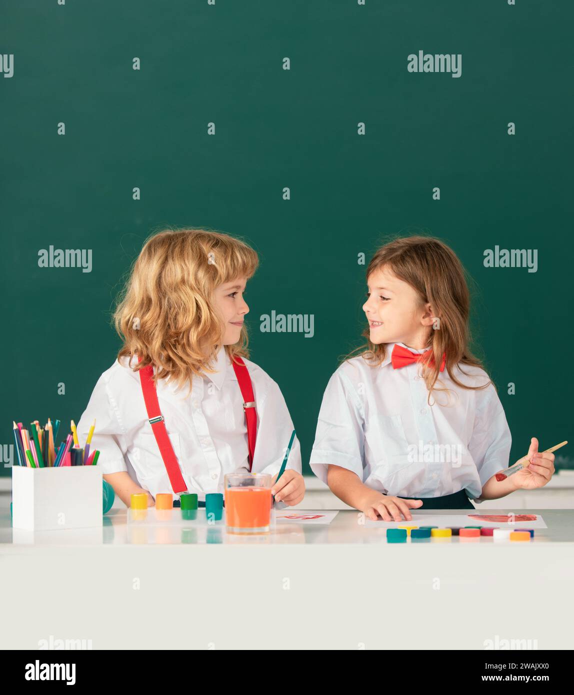 Kids early arts and crafts education. Portrait school kids doing art ...