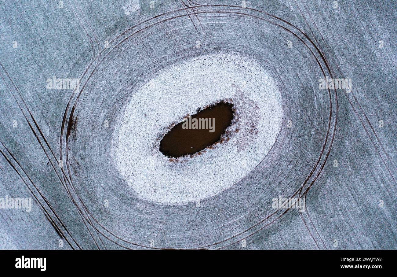 Rehna, Germany. 05th Jan, 2024. A thin layer of snow lies on a field ...