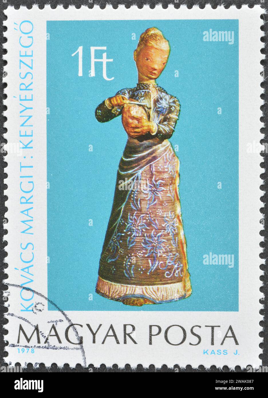 Cancelled postage stamp printed by Hungary, that shows Woman cutting ...
