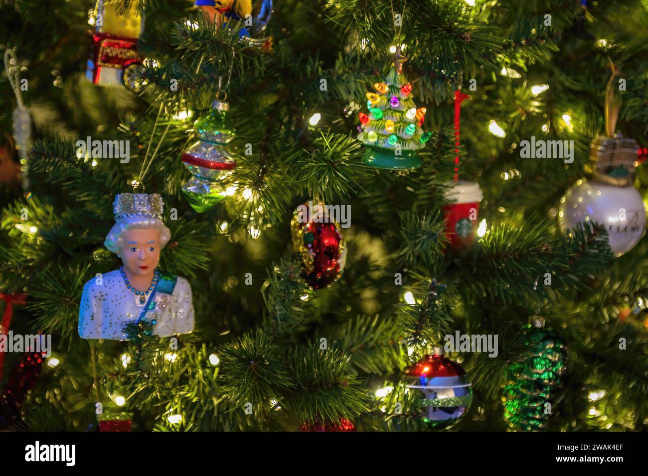 Decorated Christmas tree with a Queen Elizabeth ornament, lighted ...