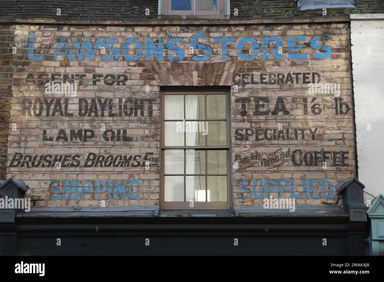 Ghost signs on a building in Whitstable, Kent Stock Photo - Alamy