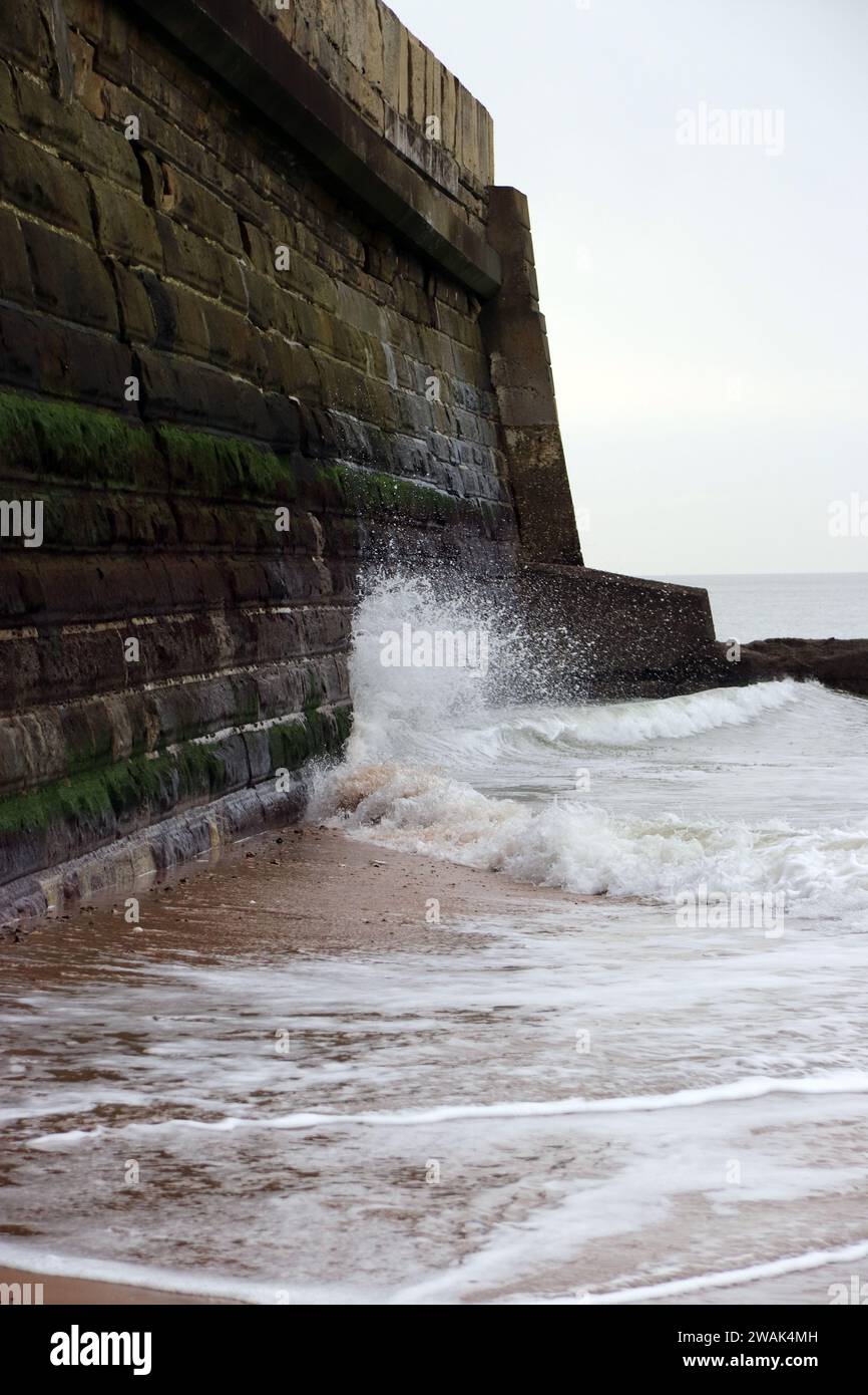 waves hitting the sea wall Stock Photo - Alamy