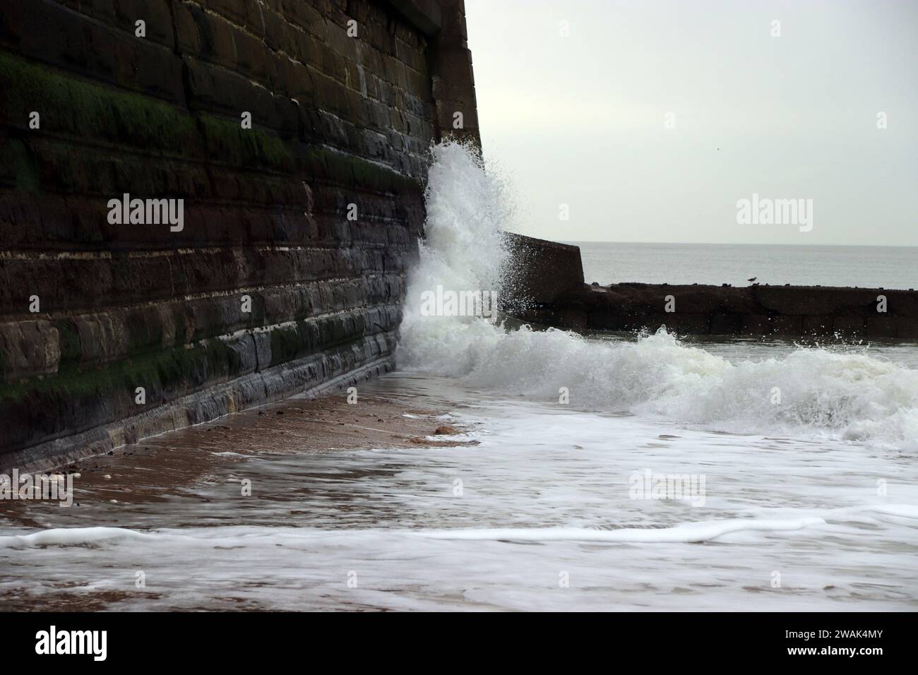 waves hitting the sea wall Stock Photo - Alamy