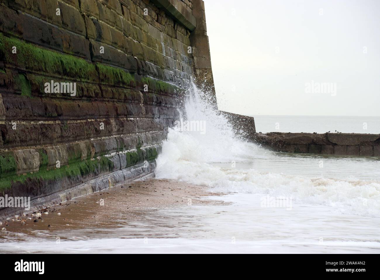 waves hitting the sea wall Stock Photo - Alamy