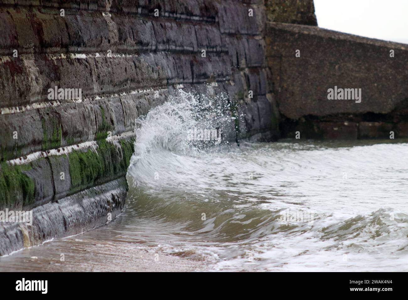 waves hitting the sea wall Stock Photo - Alamy