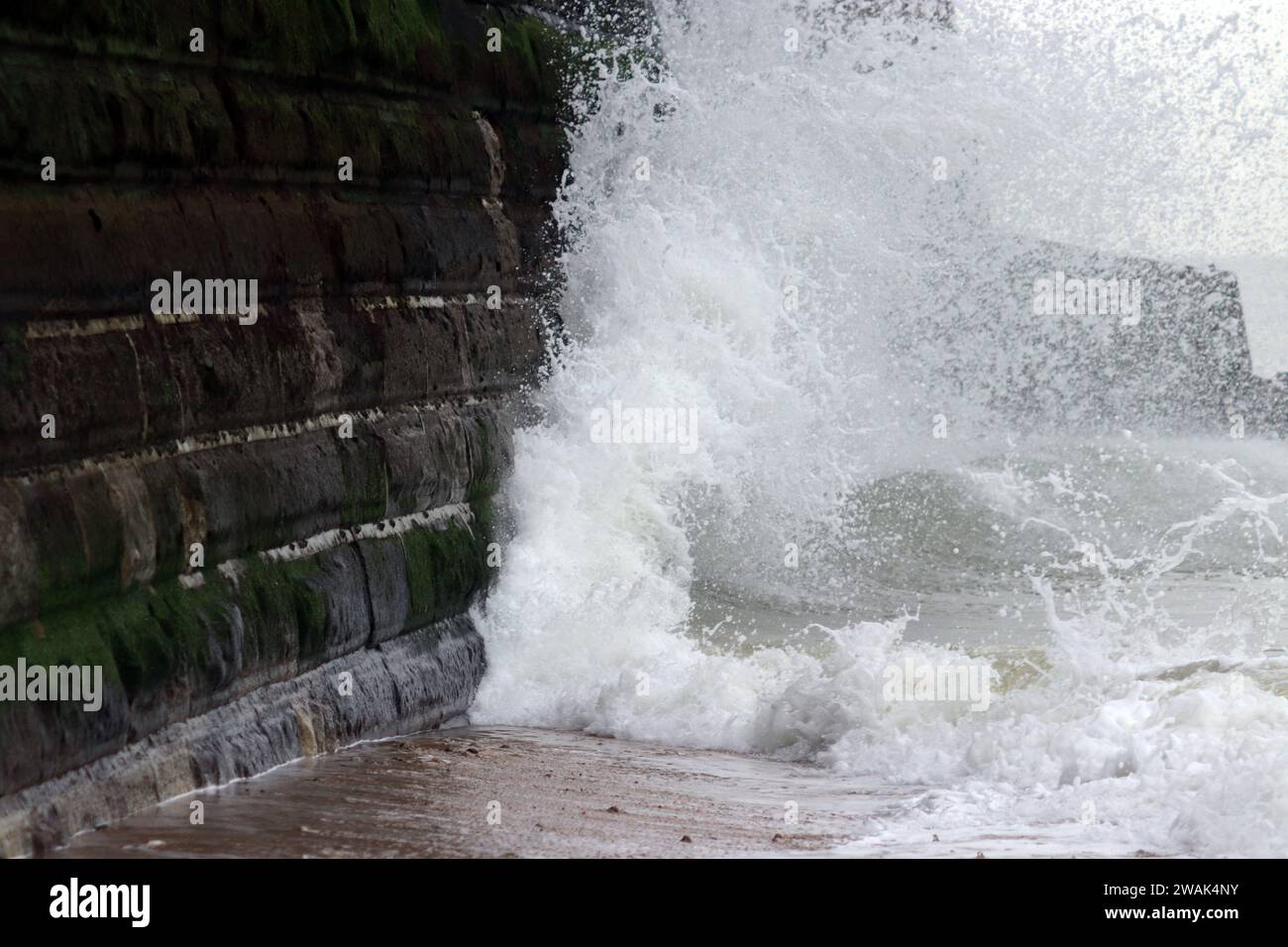 waves hitting the sea wall Stock Photo - Alamy