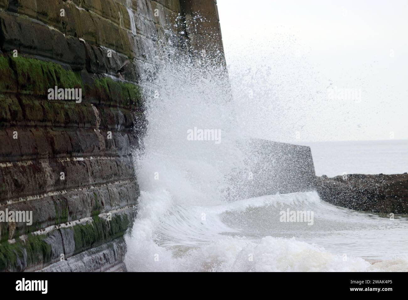 waves hitting the sea wall Stock Photo - Alamy