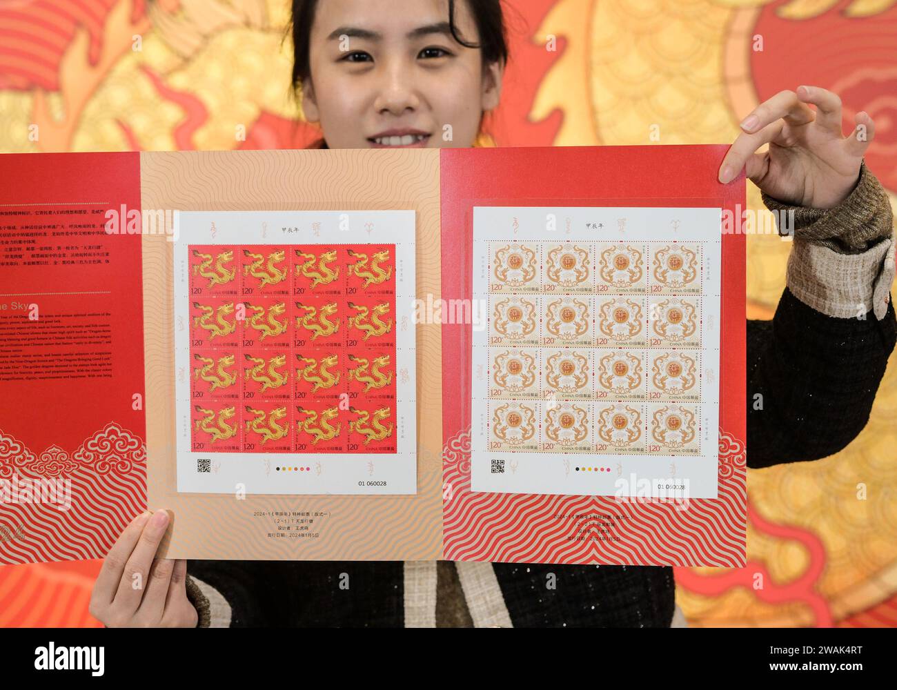 Beijing, China. 5th Jan, 2024. A customer displays her newly-purchased ...