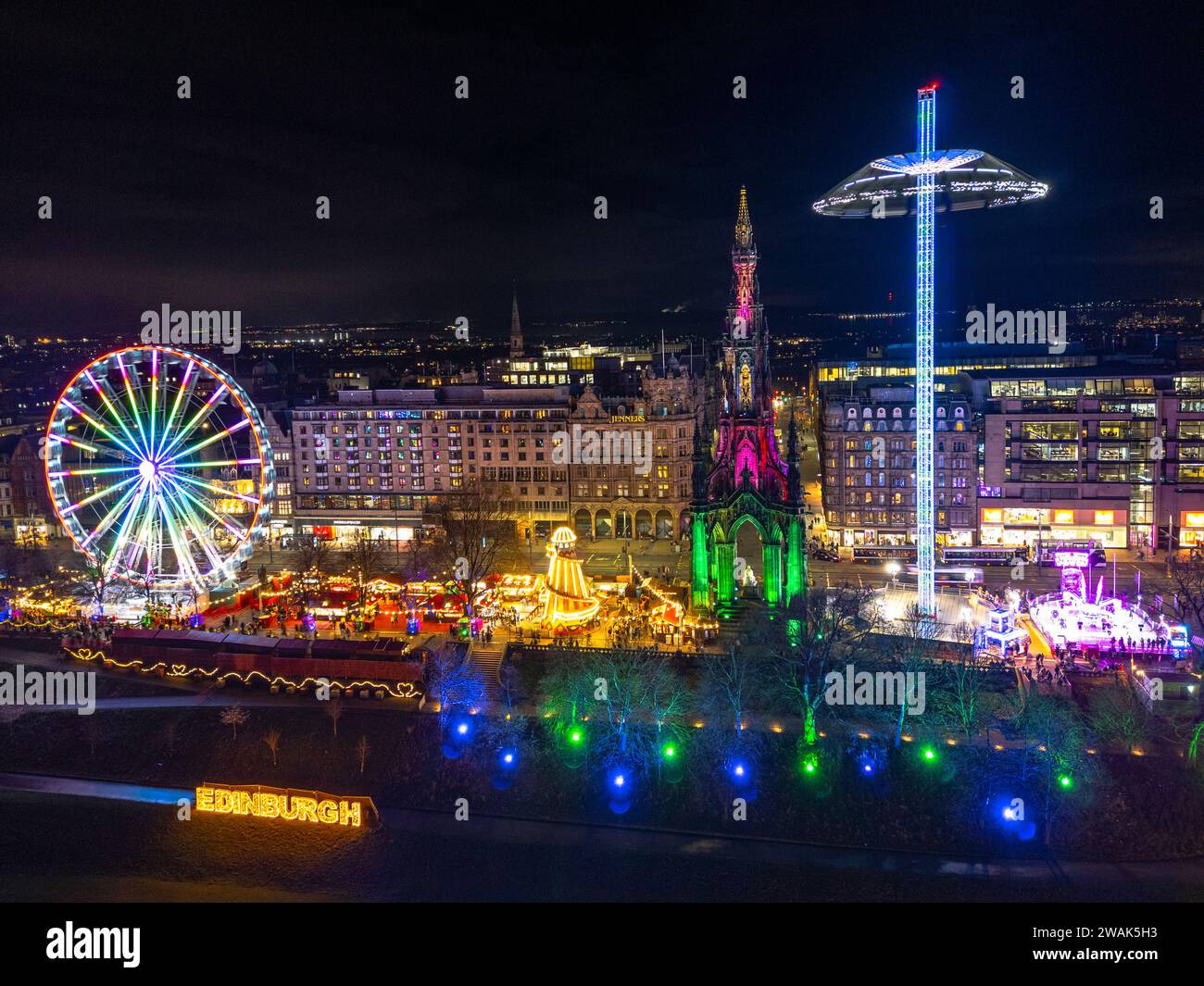Night aerial view from drone of funfair rides in Edinburgh Christmas ...