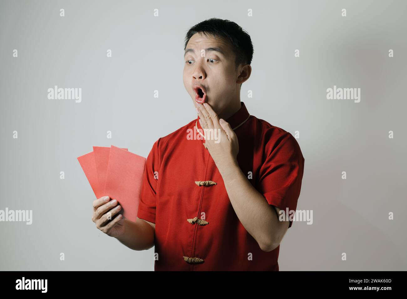 Shocked face of Asian man wearing Cheongsam or Chinese traditional ...
