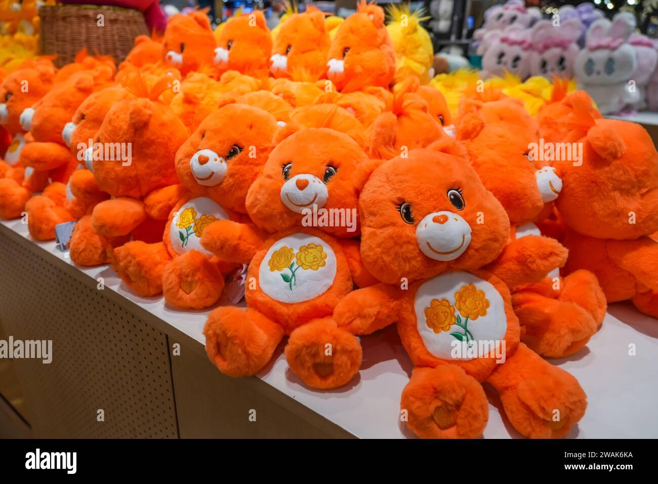 Teddy bears toys orange colored on a store shelf in a row Stock Photo ...