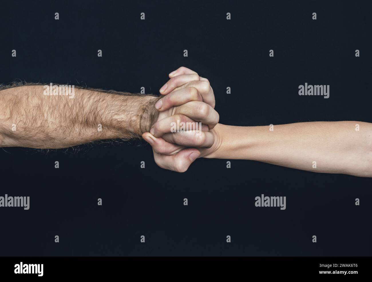 Two intertwined hands hi-res stock photography and images - Alamy