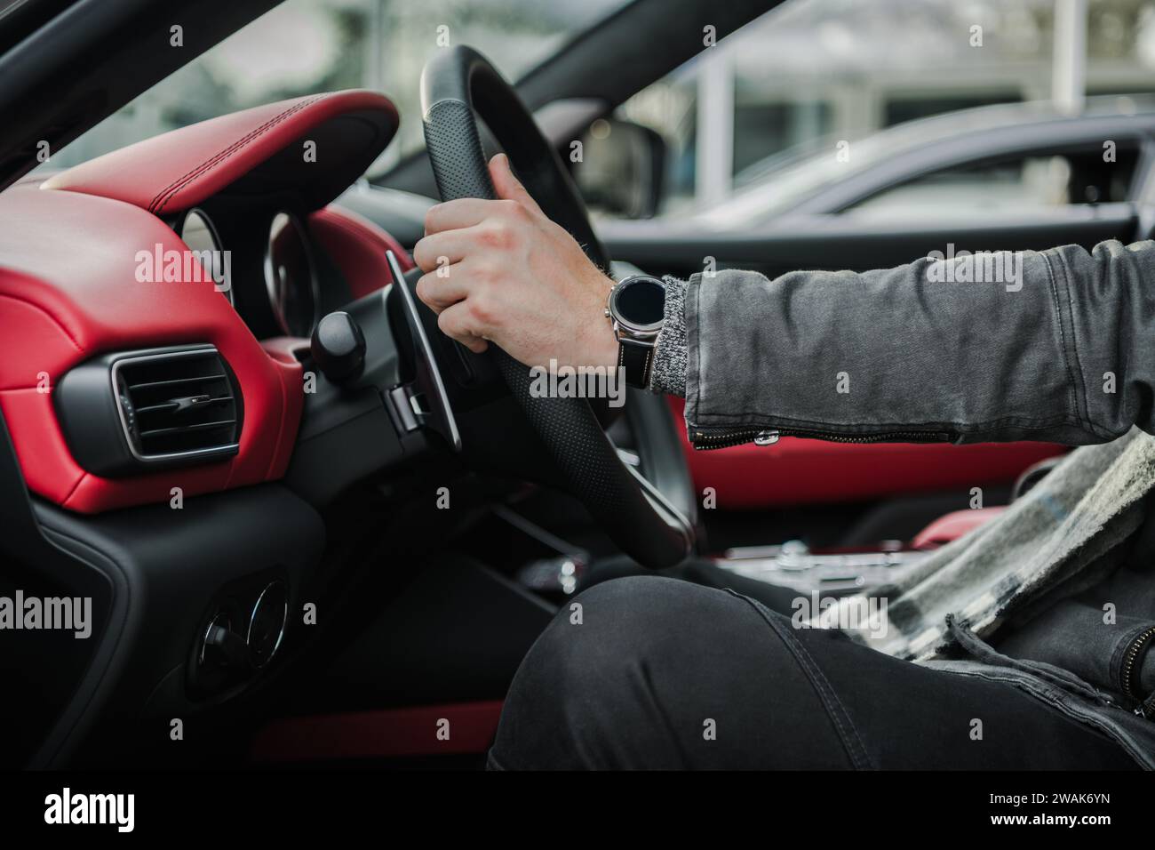 A Man Behind Performance Vehicle Steering Wheel. Automotive Industry ...