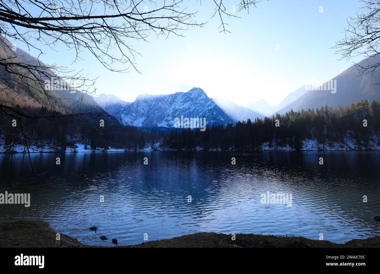 Snow capped mountain peaks of the Italian Alps in winter and glacial ...