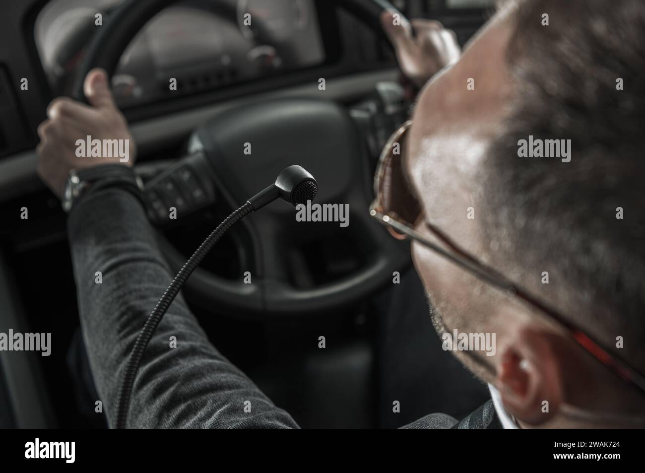Commercial Caucasian Coach Bus Driver Behind a Steering Wheel Stock ...