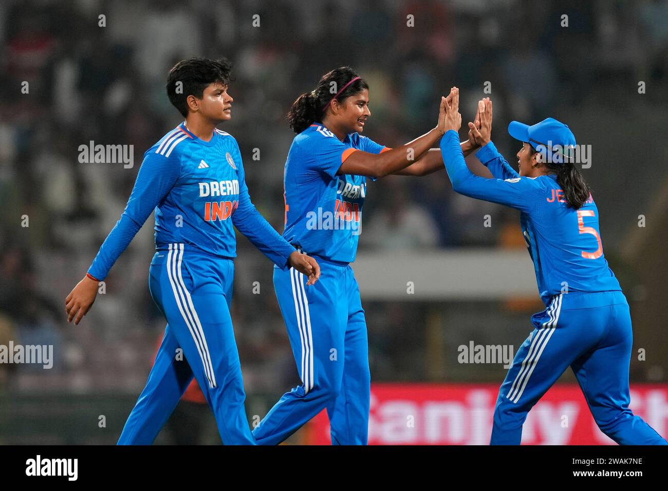 Indian cricketers celebrate the dismissal of Tahlia McGrath during the ...