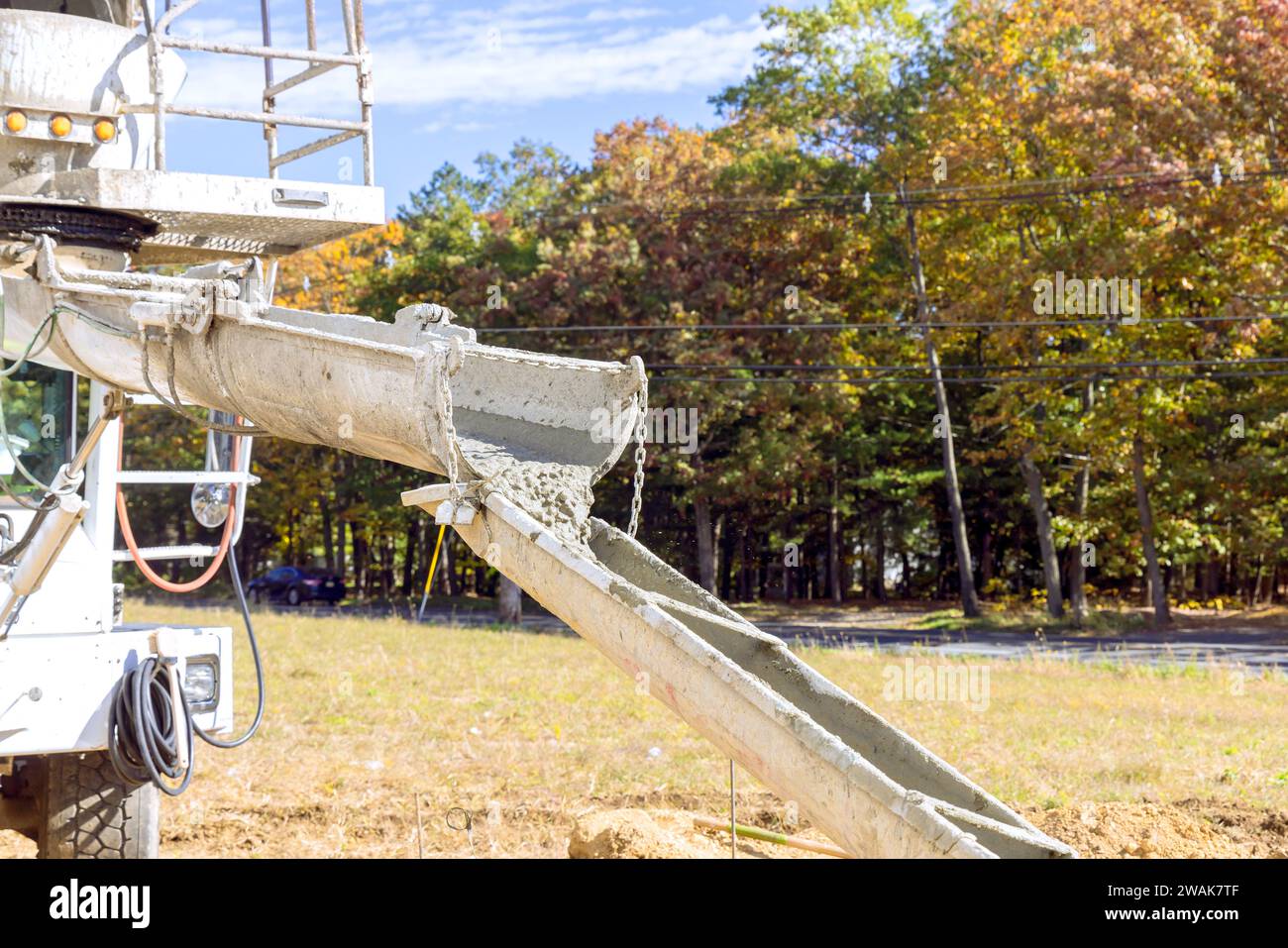 On construction site concrete mixer truck poured liquid cement concrete ...