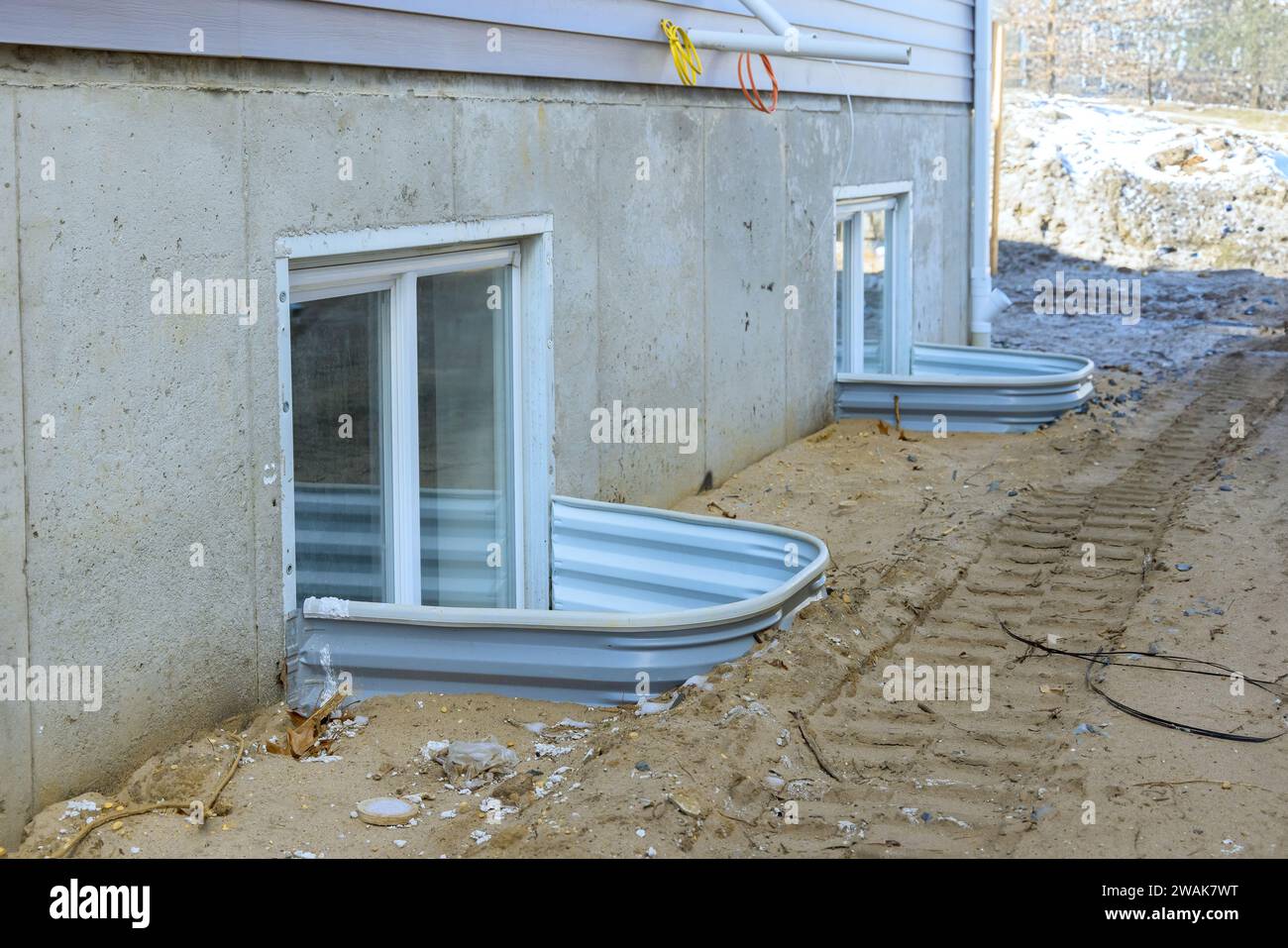 Adding window well to basement of new house under construction Stock ...