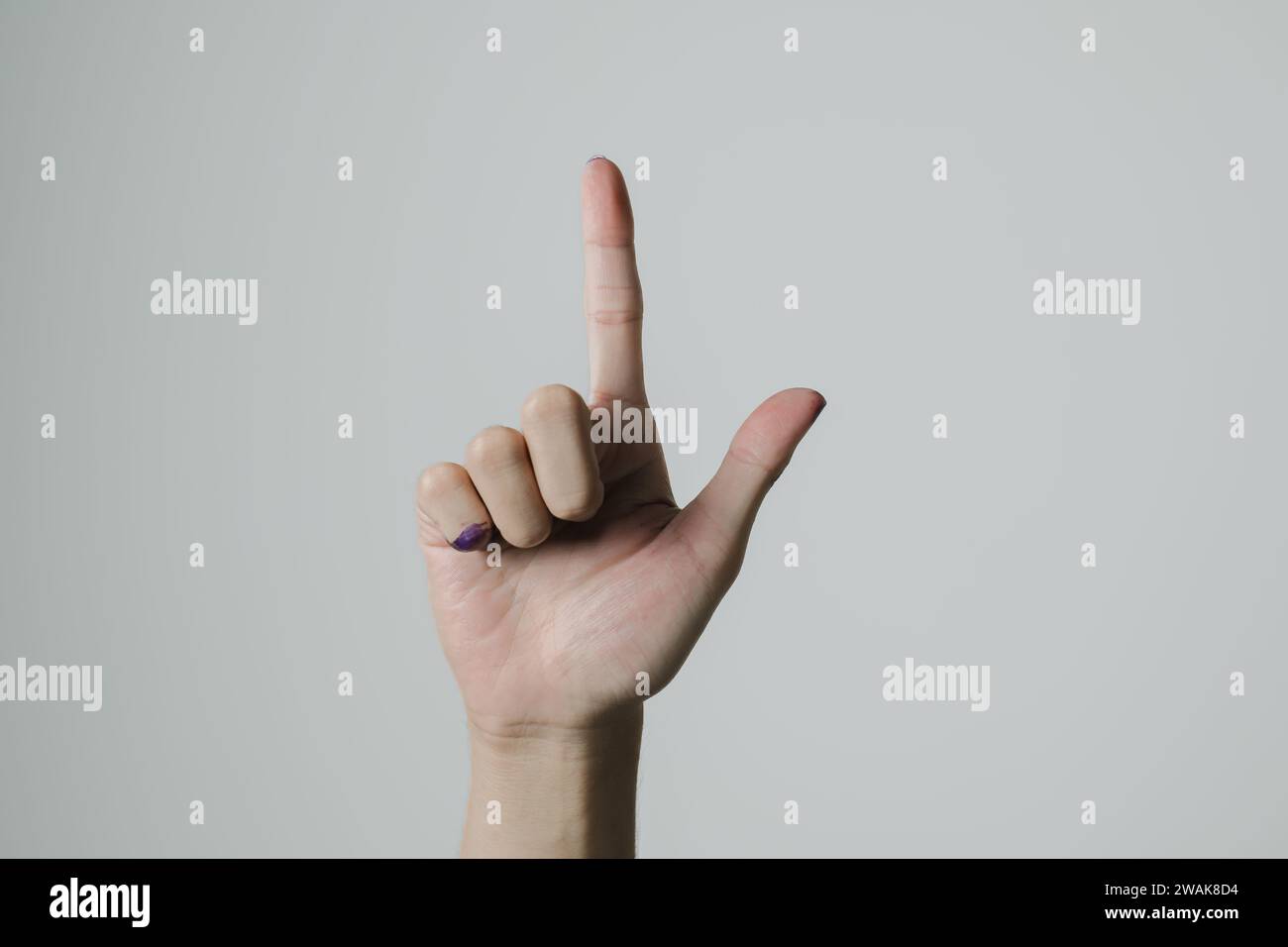 A hand pointing up after pemilu or Indonesian election day on white ...