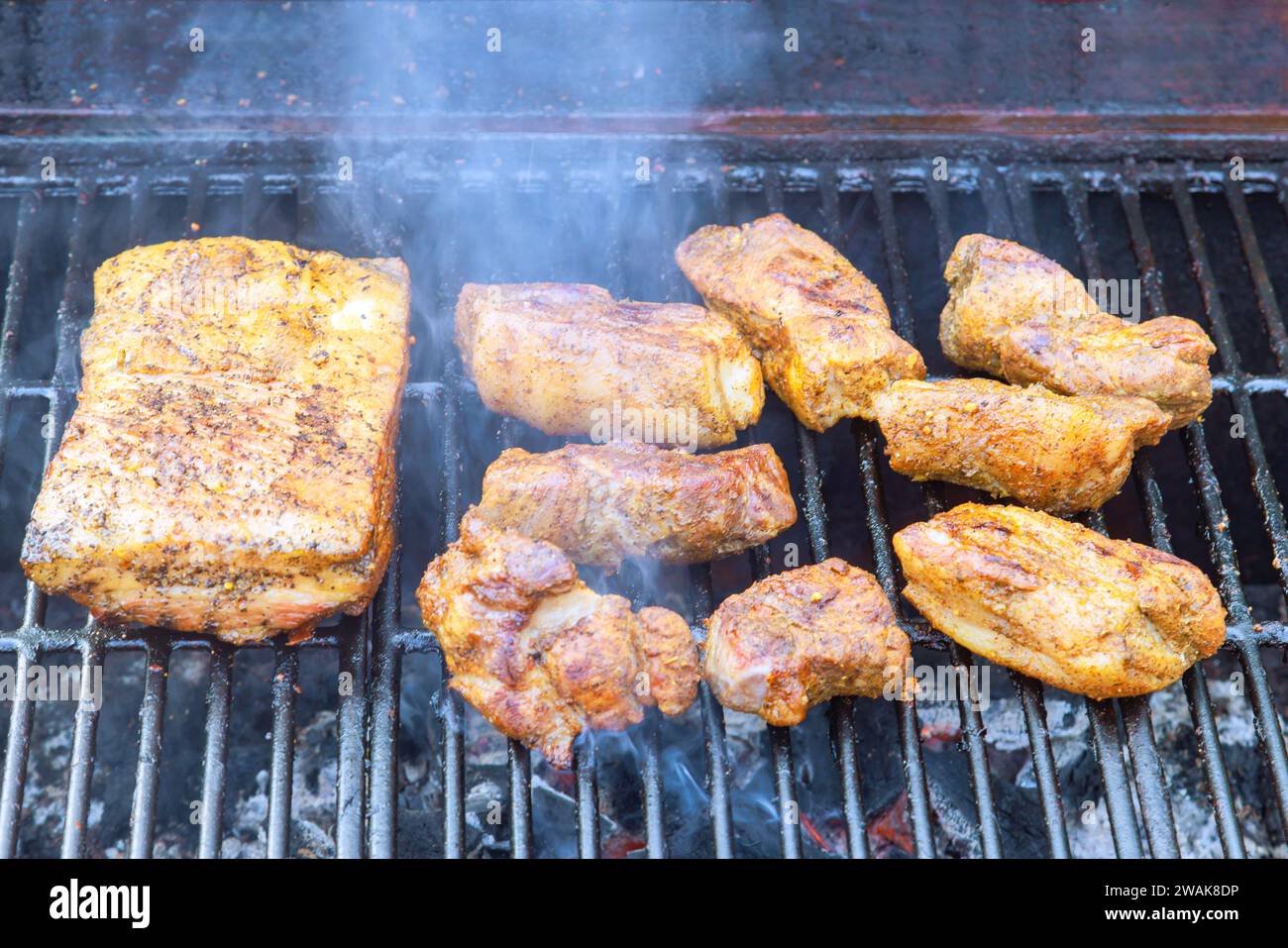 Bacon large, pieces pork meat are BBQ grilled smoked Stock Photo - Alamy