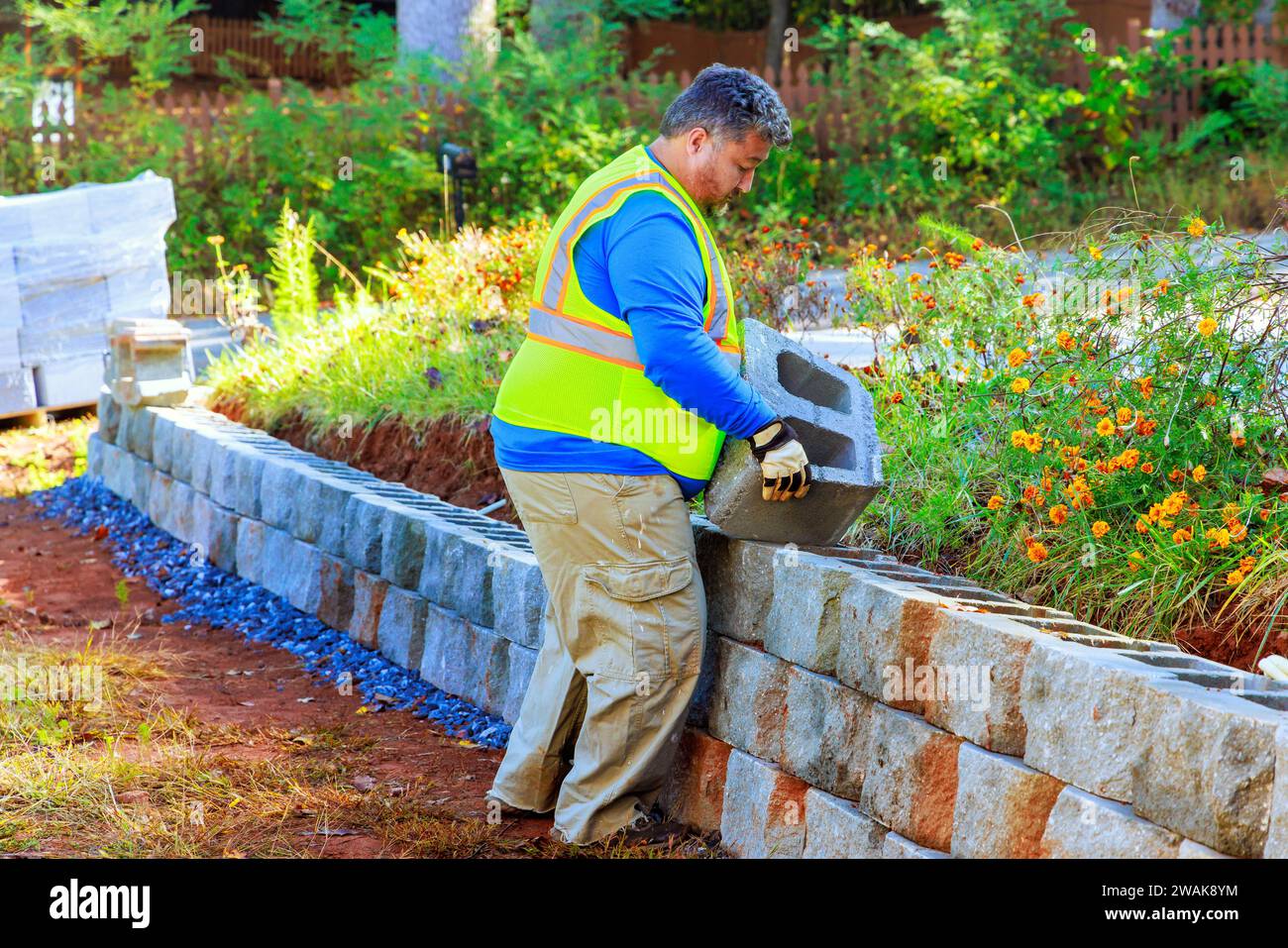 Contractor is installing concrete block walls as part construction of ...