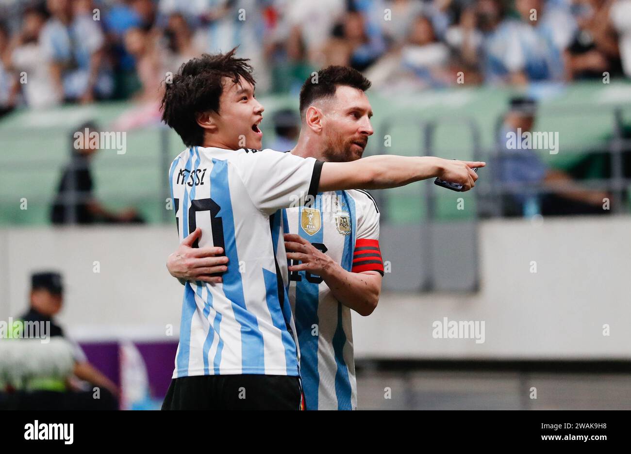 Beijing, China. 15th June, 2023. A pitch-invading fan (L) hugs Lionel ...