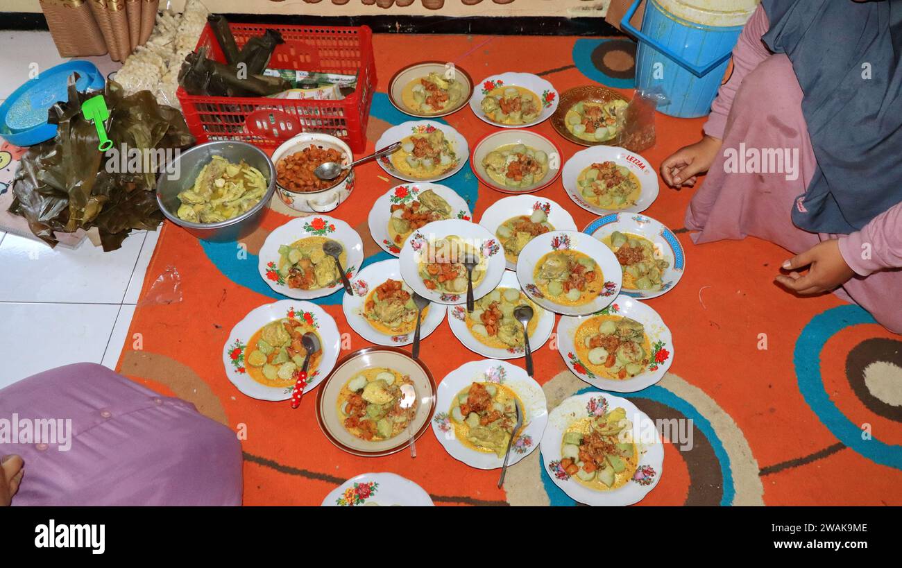 Lontong sayur or vegetable rice cake is an Indonesian traditional rice ...