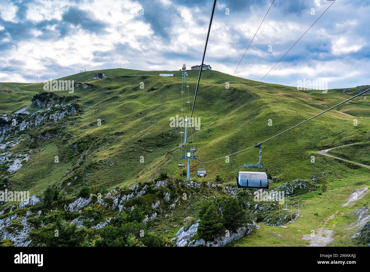 Chairlift or cable car riding over Swiss Alps on Stoos village and ...