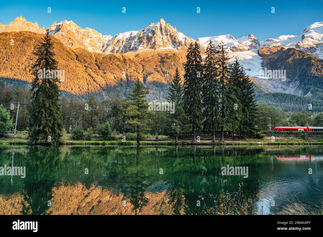 Beautiful view of Lac des Gaillands with train passing and Mont Blanc ...