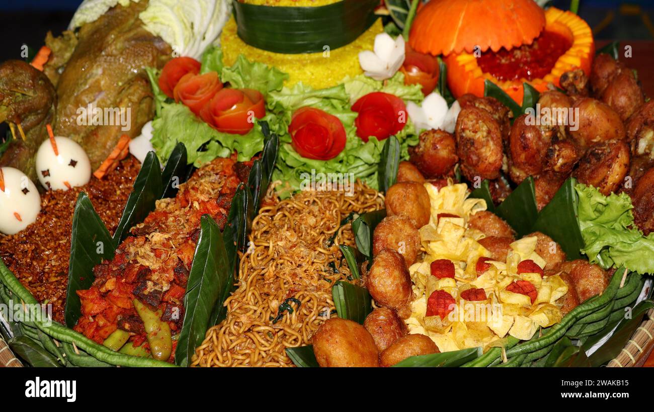 Rice in a cone shape or called Nasi Tumpeng A festive Indonesian rice ...