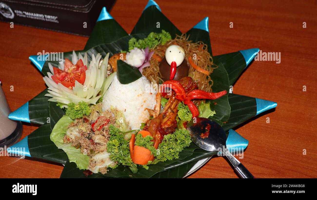 Rice in a cone shape or called Nasi Tumpeng A festive Indonesian rice ...