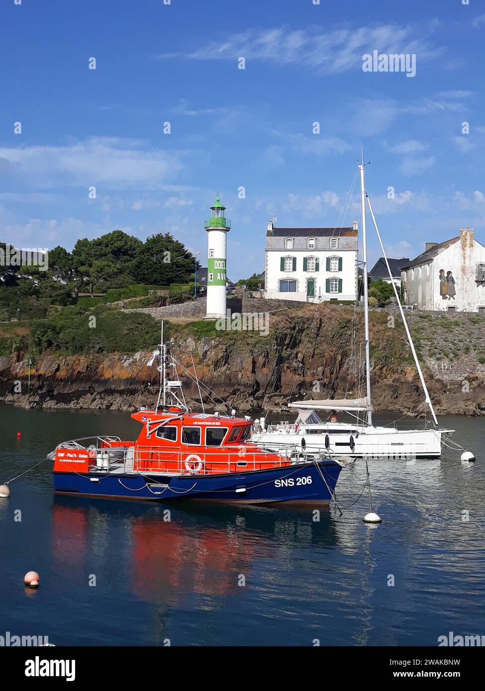 SNSM boat in Doelan harbour, Aval lighthouse, Finistere, Bretagne ...