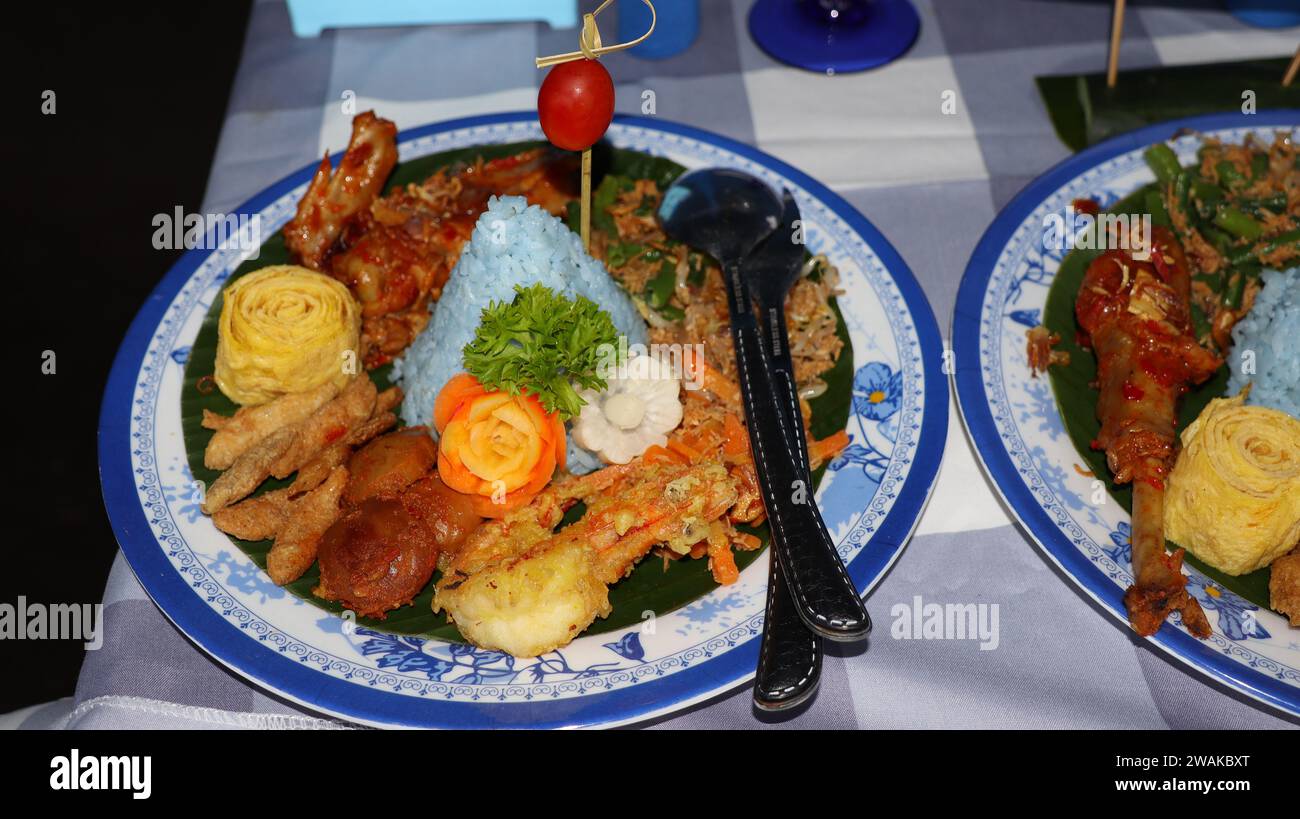 Rice in a cone shape or called Nasi Tumpeng A festive Indonesian rice ...