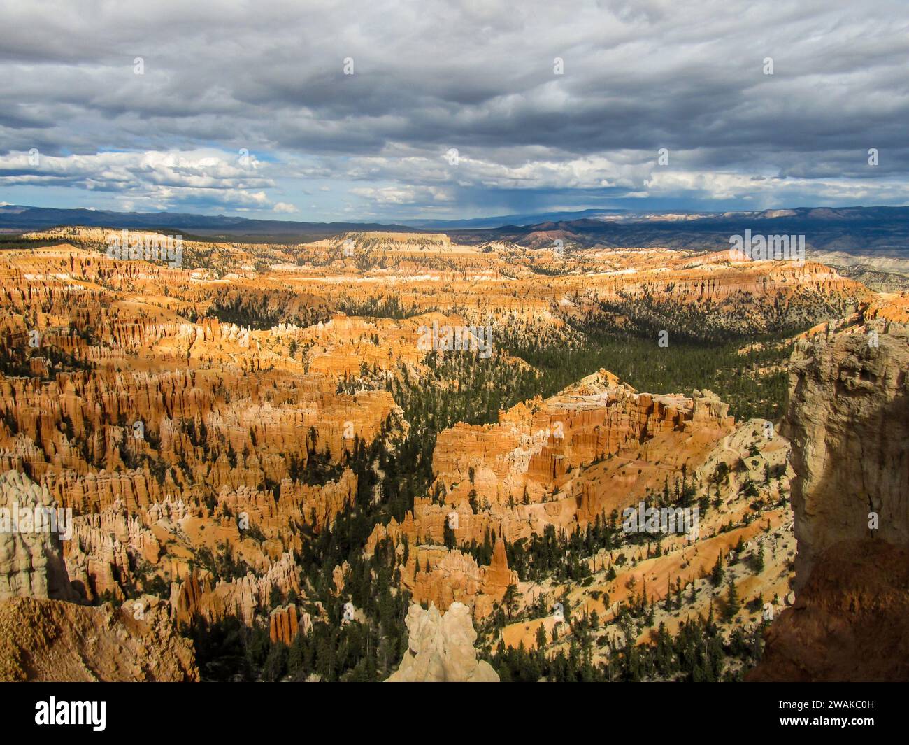 Dramatic clouds gathering over the vibrant and multi colours hoodoos ...