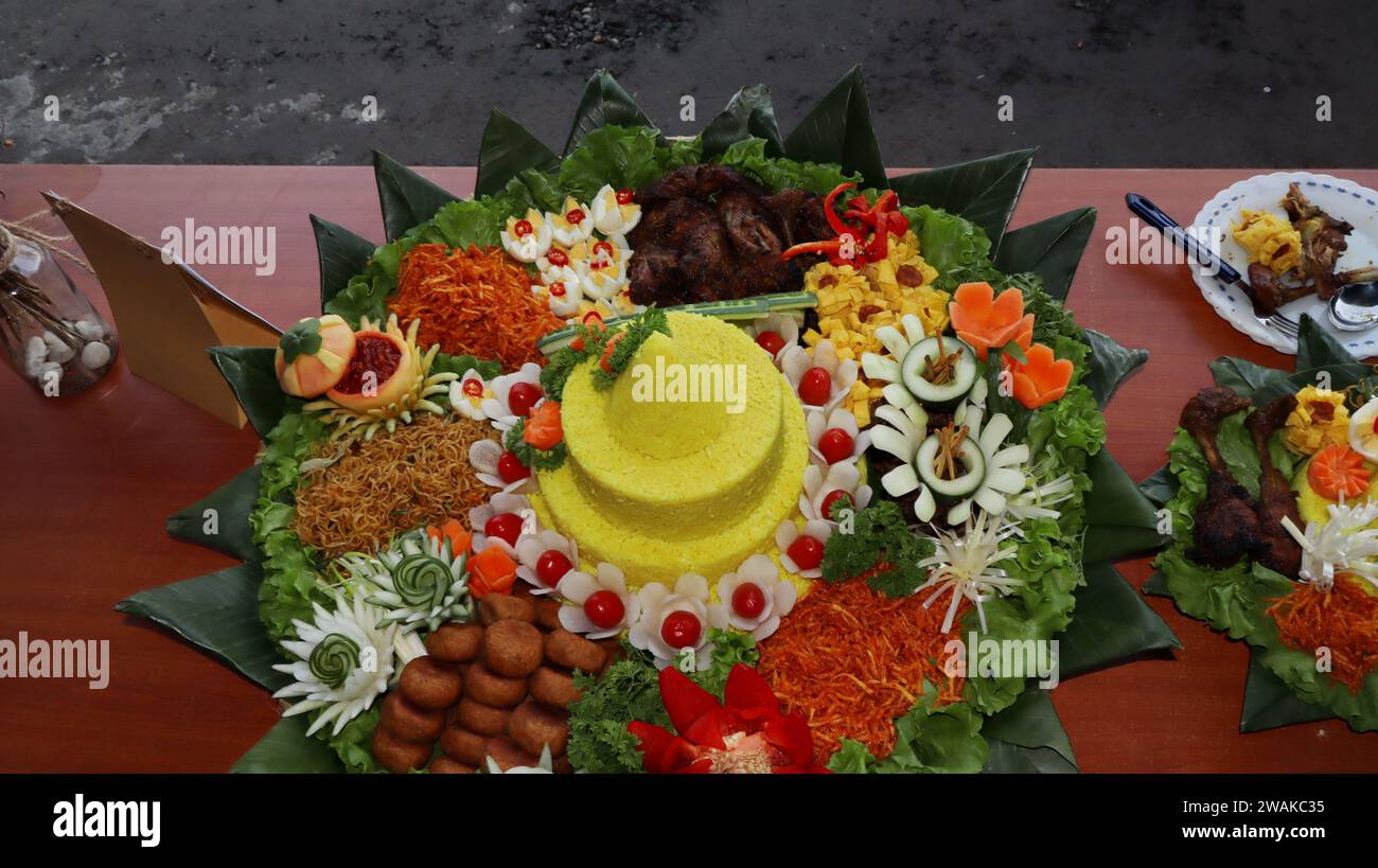 Rice in a cone shape or called Nasi Tumpeng A festive Indonesian rice ...