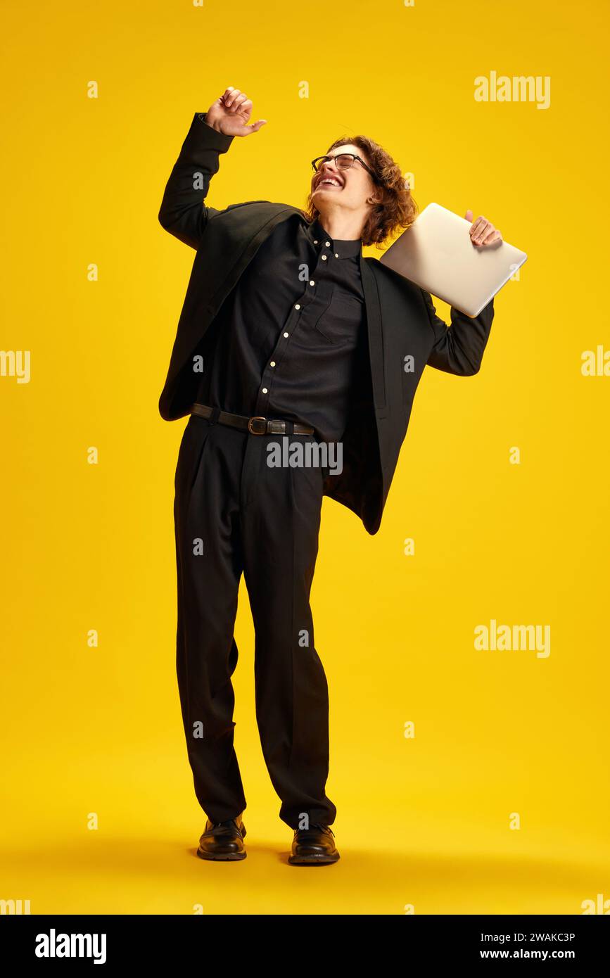 Guy looking laptop raised hands hi-res stock photography and images - Alamy