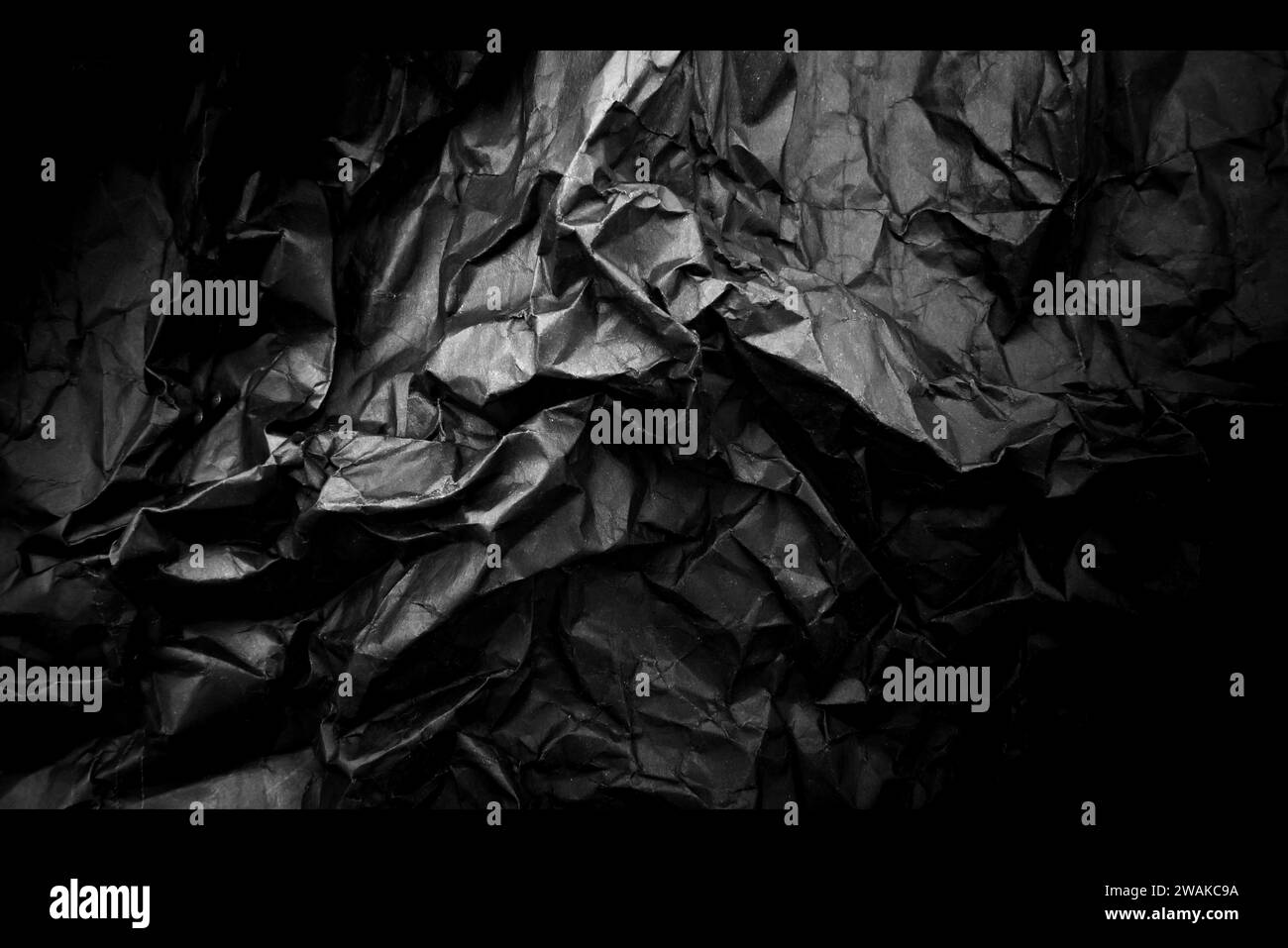 Texture of crumpled black paper with gradient. Dark paper background ...