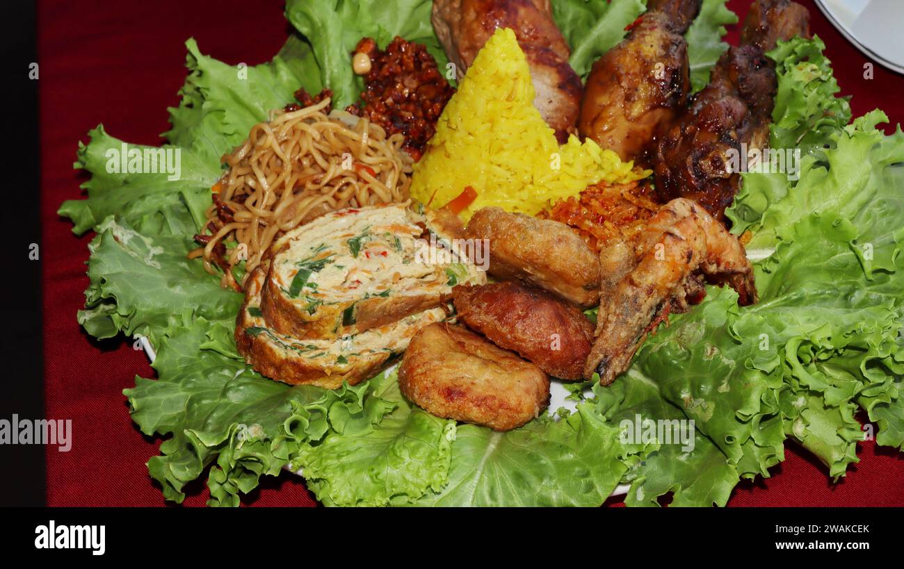 Rice in a cone shape or called Nasi Tumpeng A festive Indonesian rice ...