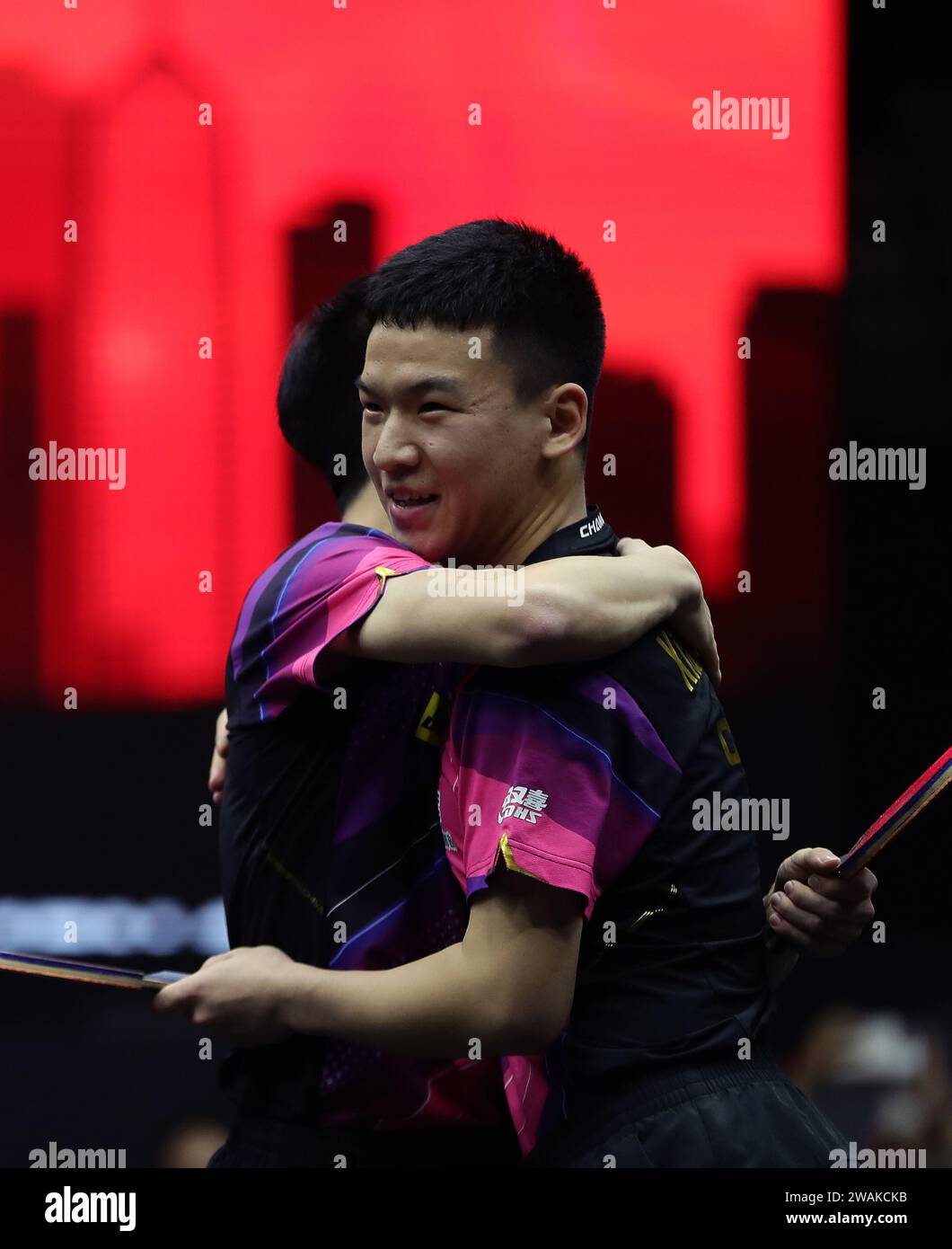 Doha, Qatar. 5th Jan, 2024. Yuan Licen/Xiang Peng (R) celebrate after ...
