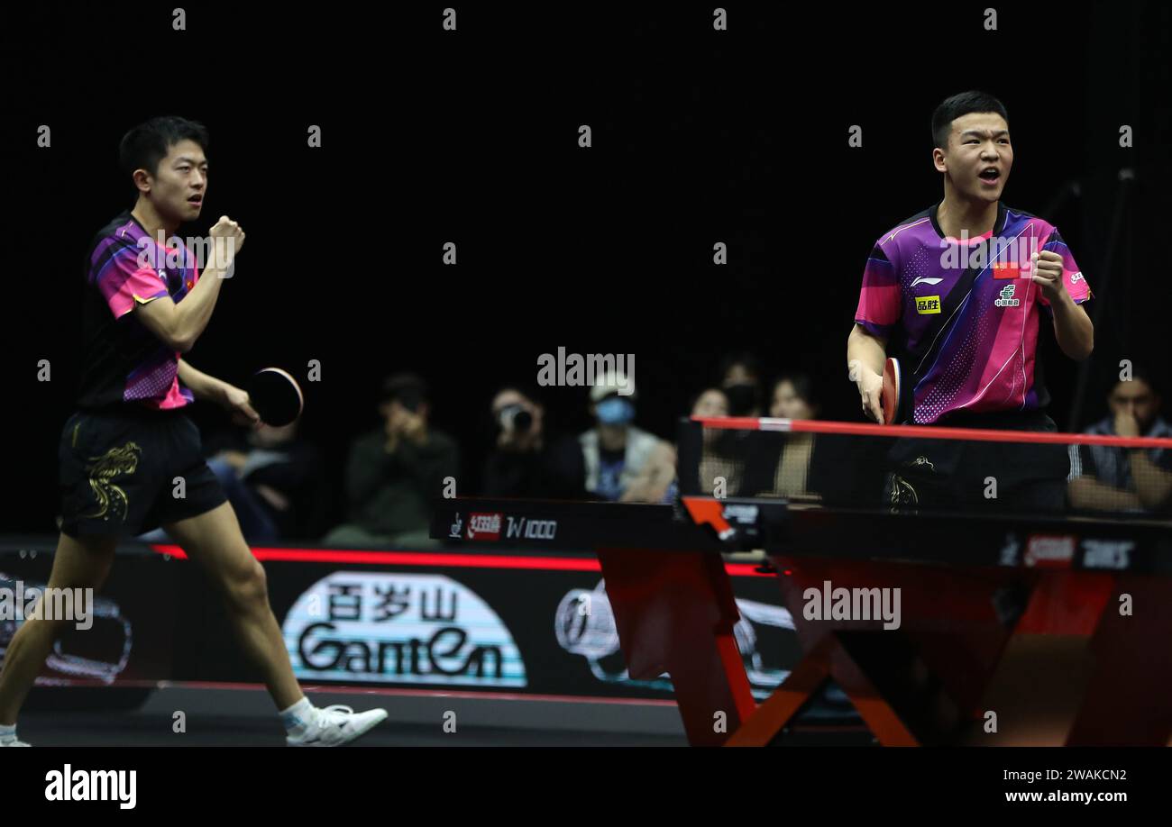 Doha, Qatar. 5th Jan, 2024. Yuan Licen/Xiang Peng (R) celebrate during ...