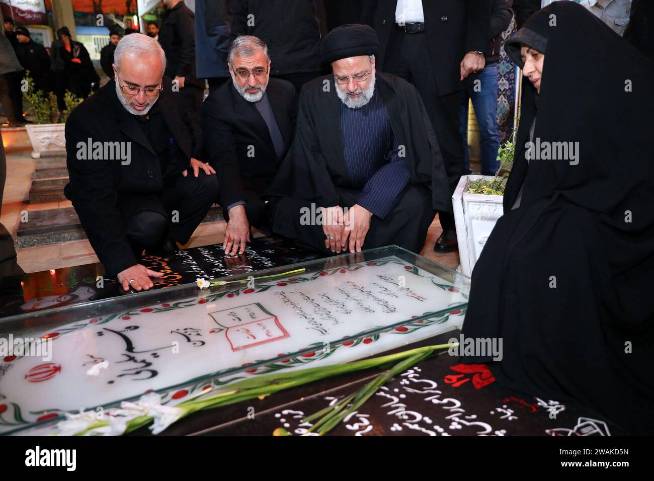 Kerman, Iran. 5th Jan, 2024. Iranian President EBRAHIM RAISI (2R ...