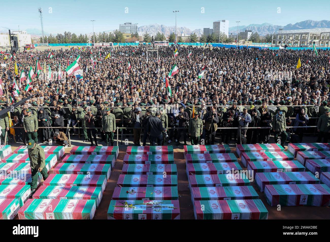 Kerman, Iran. 5th Jan, 2024. The flag-draped coffins are placed on the ...