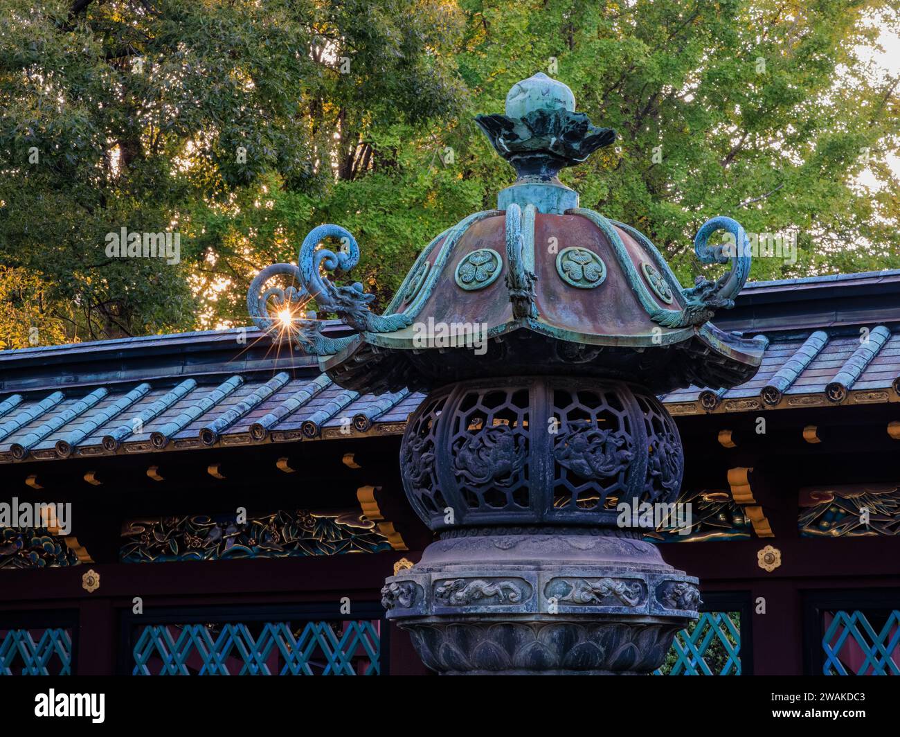 a sunburst effect highlights the ornately carved and patterned copper ...