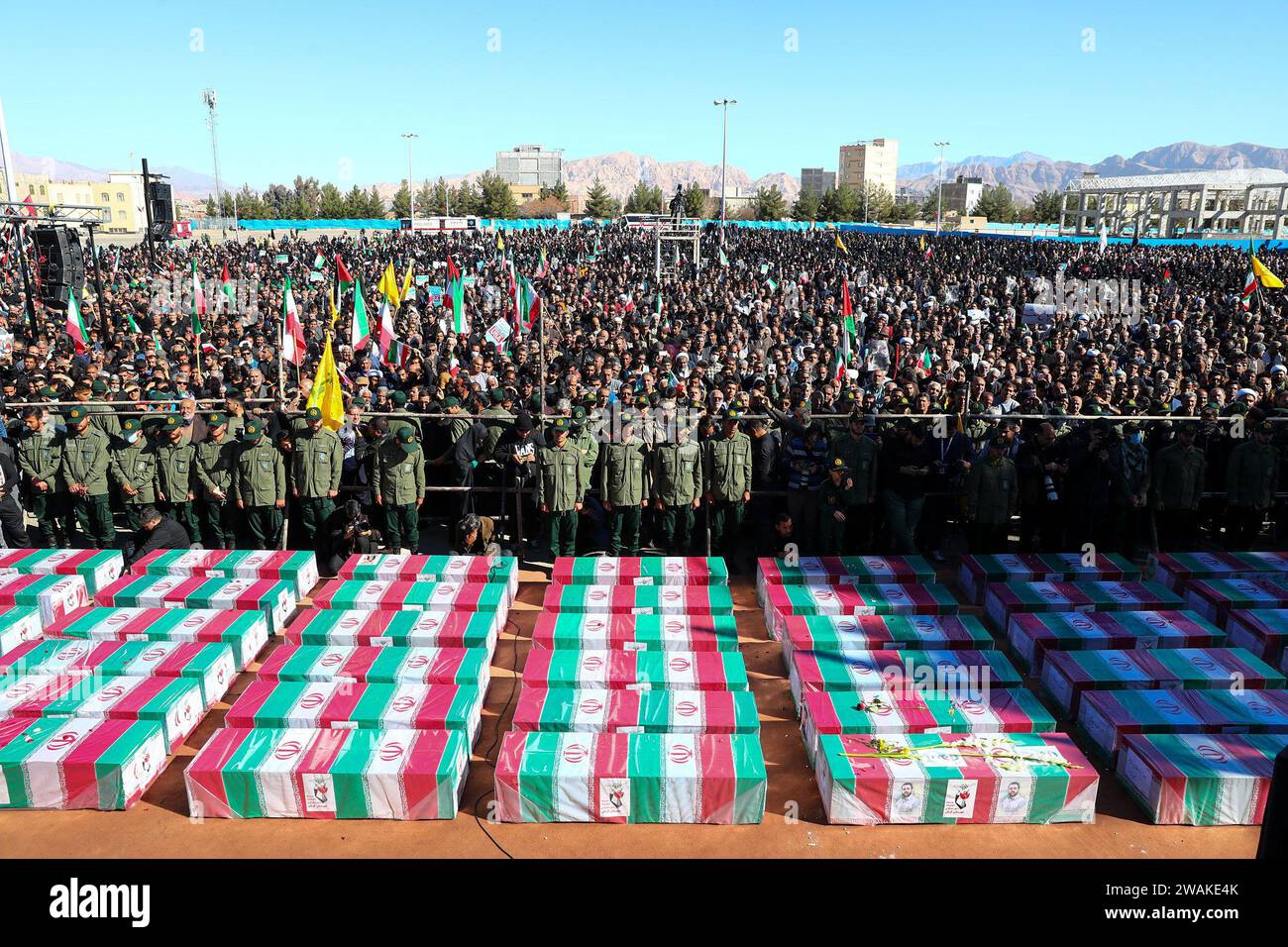 Kerman, Iran. 5th Jan, 2024. The flag-draped coffins are placed on the ...