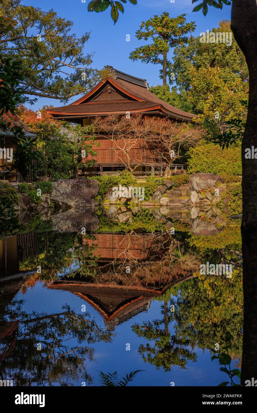 sanshu-tei traditional tea house is reflected in the mirror pond of the ...
