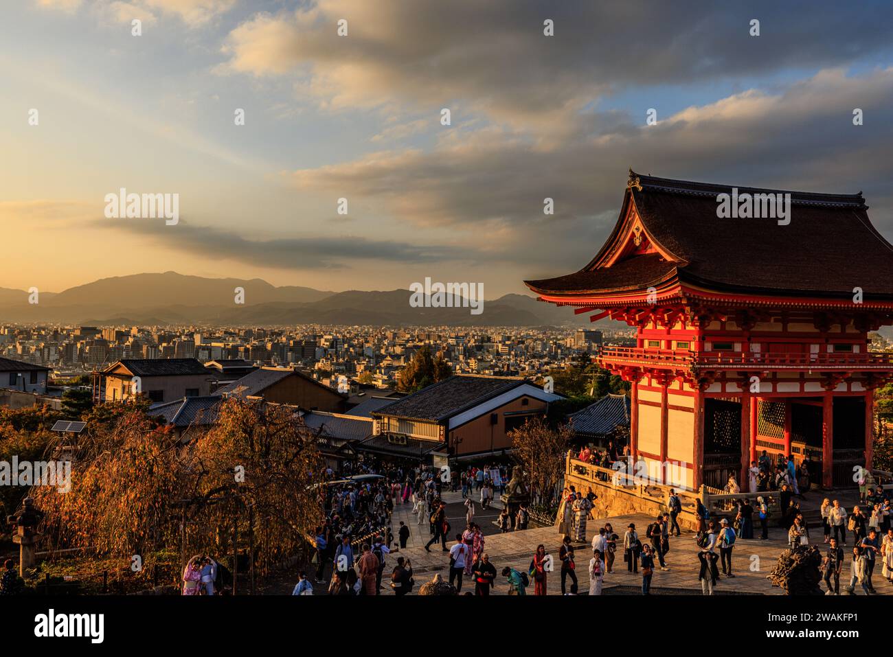the red painted niomon gate of kyomizu-dera temple is lit by early ...