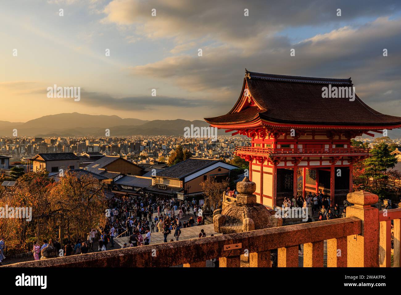 the red painted niomon gate of kyomizu-dera temple is lit by early ...