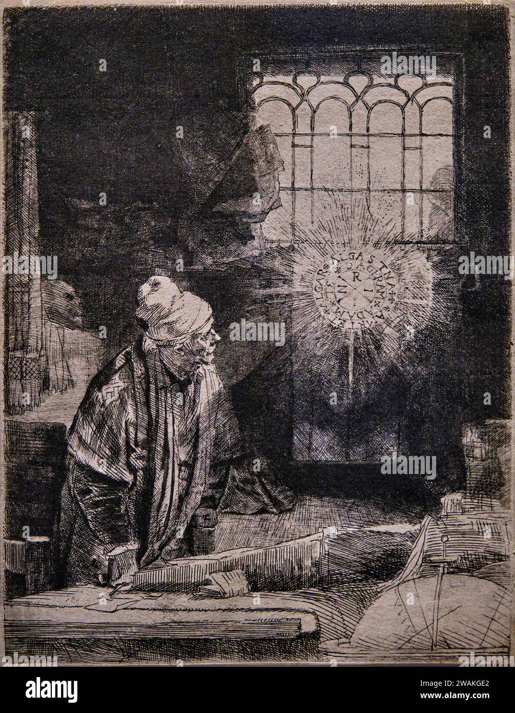 Rembrandt etching exhibition, Scholar in his study, 1652 Stock Photo ...