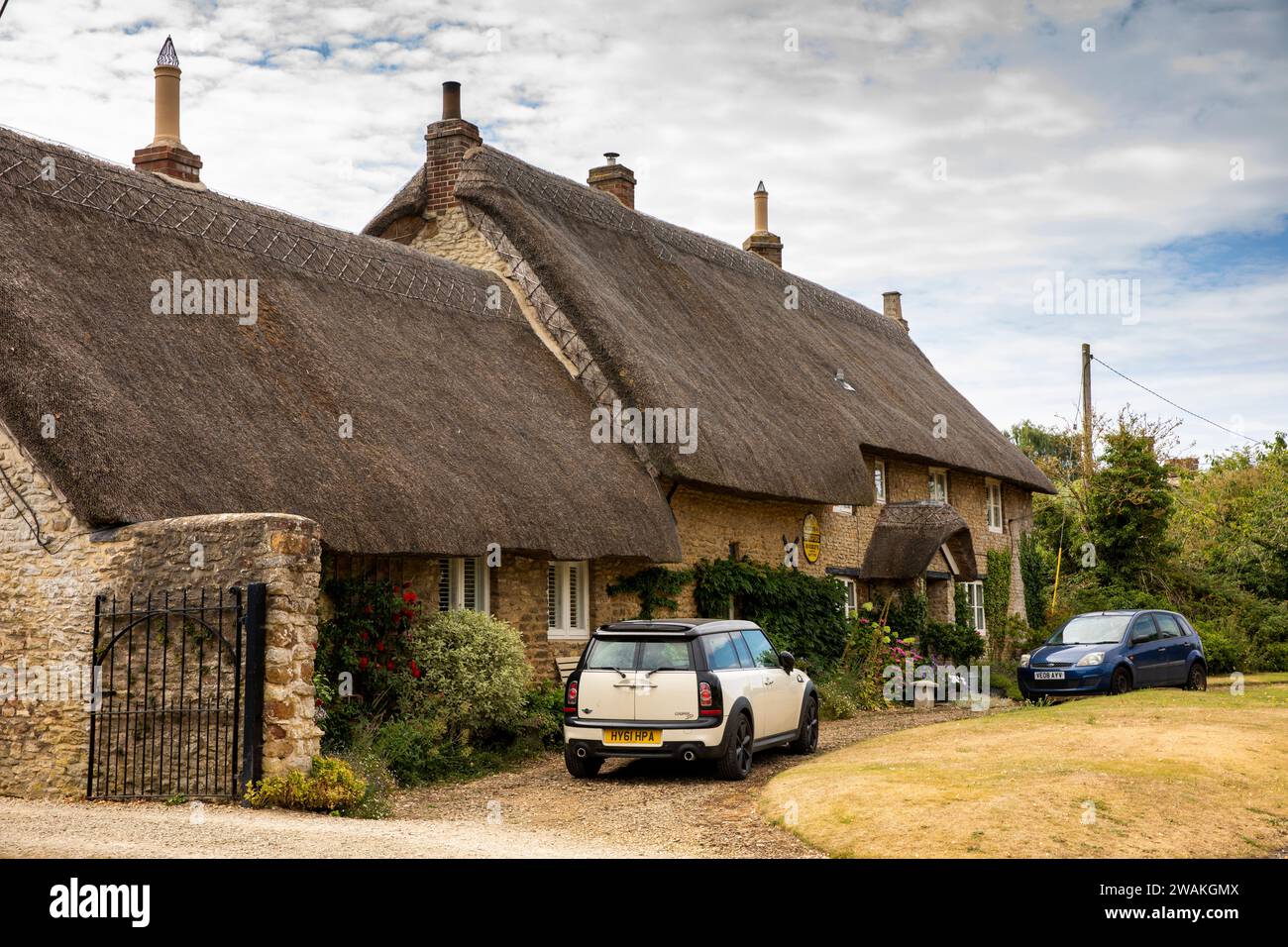 UK, England, Oxfordshire, Fringford, Main Street, old forge and post ...